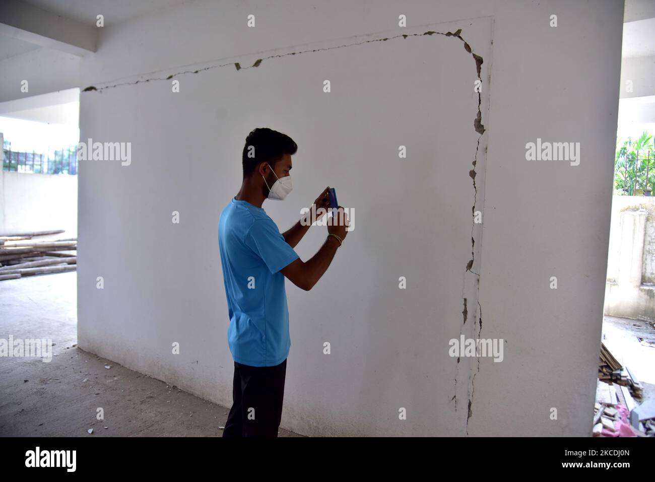 A cracks in a wall at an apartment building after a high-intensity ...