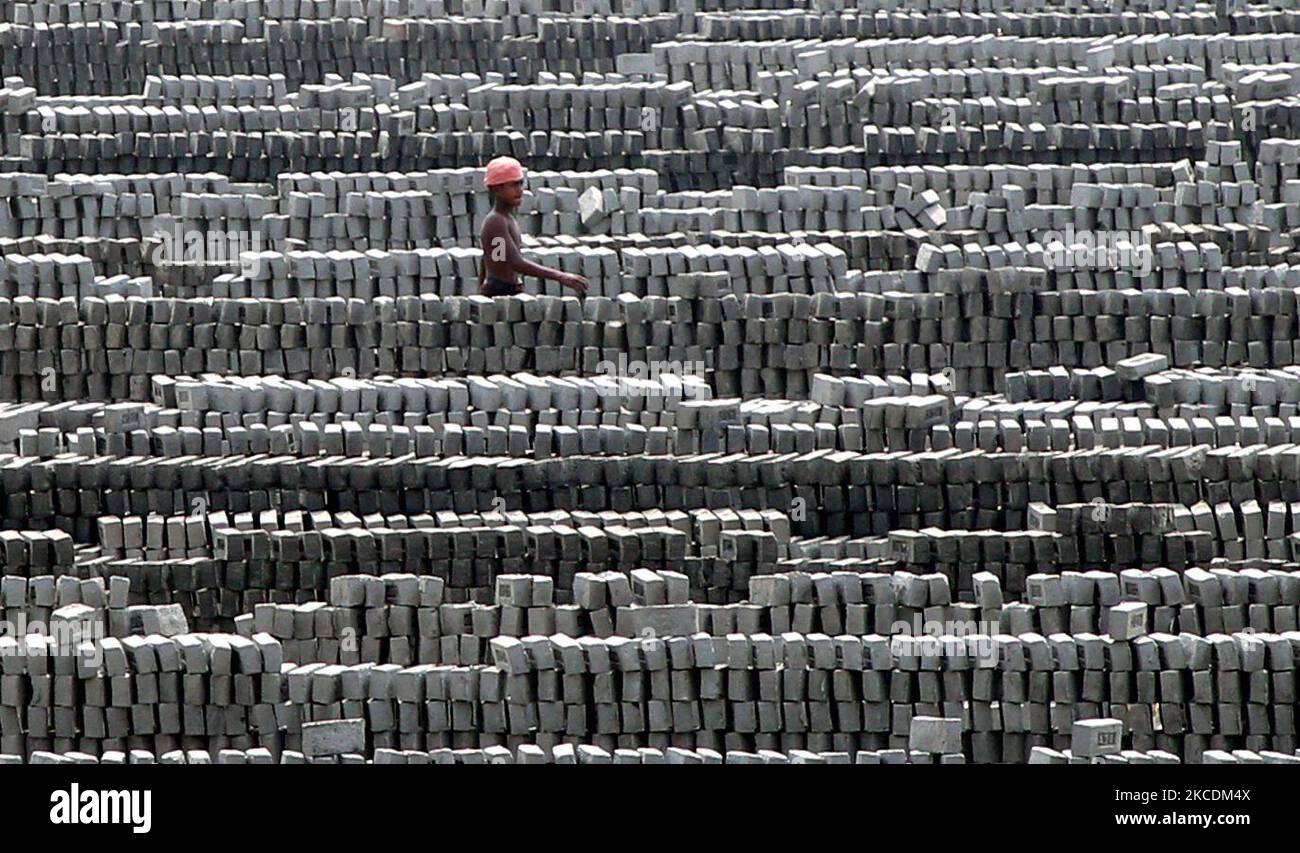 Labourers working at a brickfield on the outskirts of Dhaka, Bangladesh ...