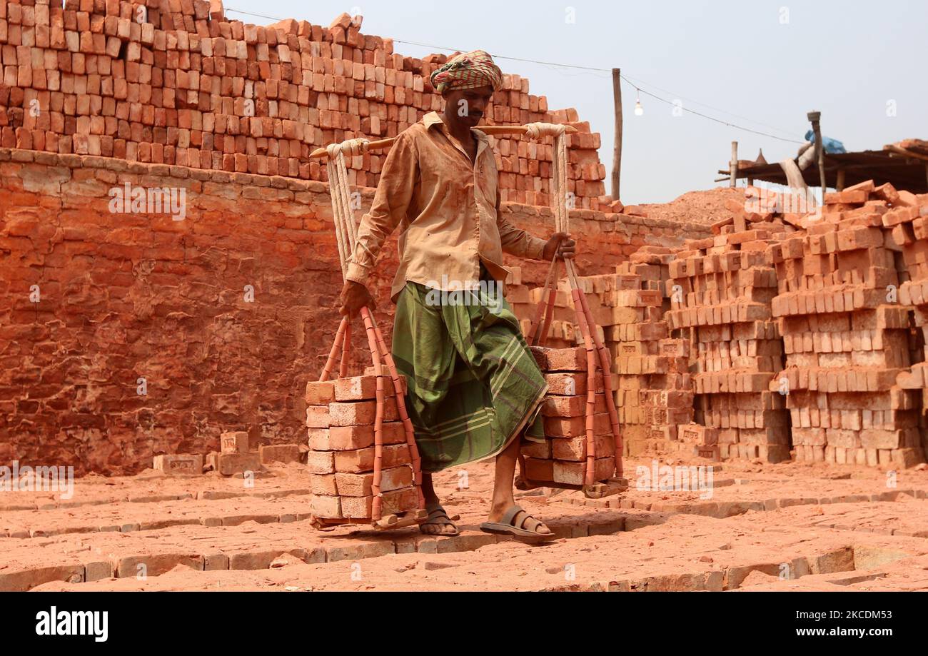 Labourers working at a brickfield on the outskirts of Dhaka, Bangladesh ...