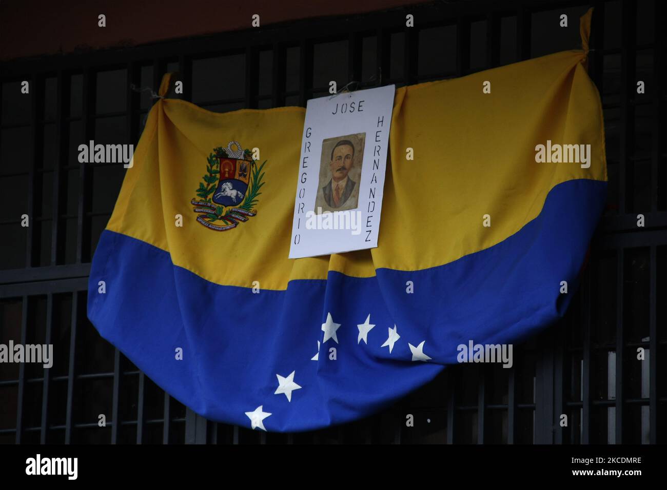 A Venezuelan flag with the image of the Venezuelan saint JosÃ© Gregorio ...