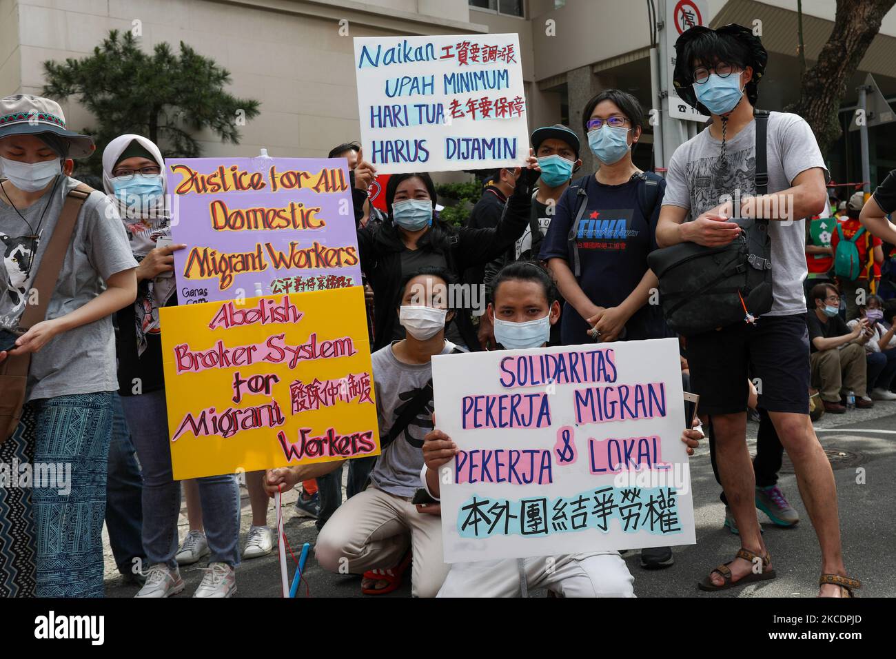 Migrant Worker Marching signs and banners asking for better labor ...