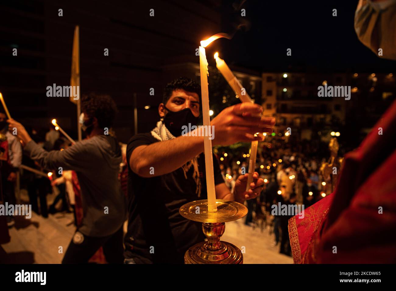Worshippers getting the "Holy Fire" (Holy Light). It's the flame that ...