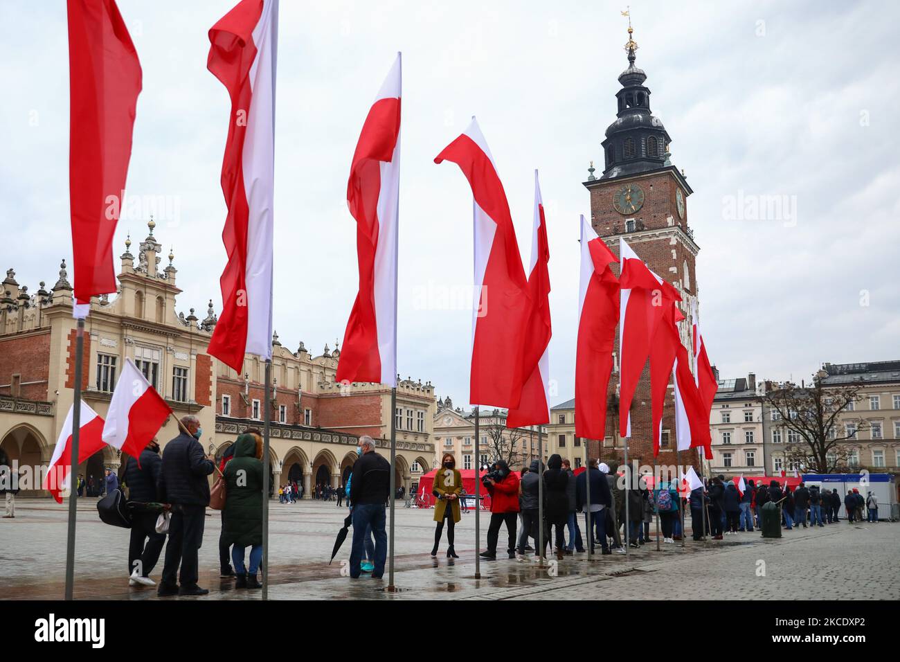 People hold flags celebrating Polish National Flag Day while standing ...