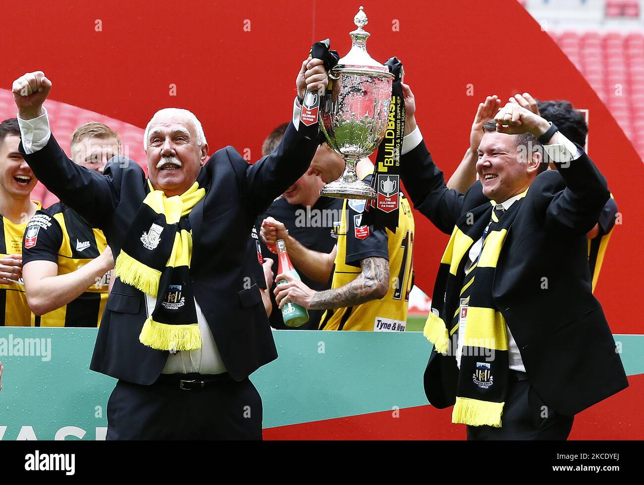 Chairman Vincent Pearson (Left) celebrates they win with Trophy during ...
