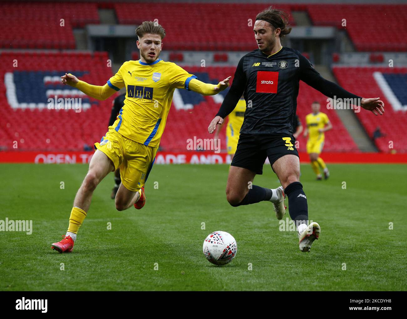 L-R Lewis Simper of Concord Rangers (on loan from Cambridge United) and ...