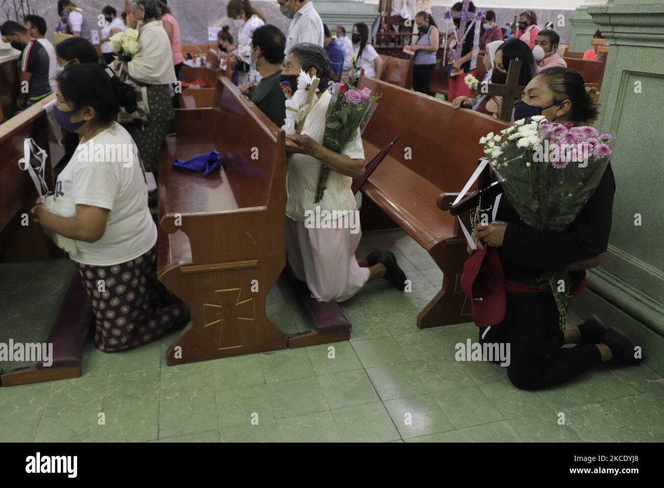 People kneeling inside the Church of the Immaculate Conception located ...