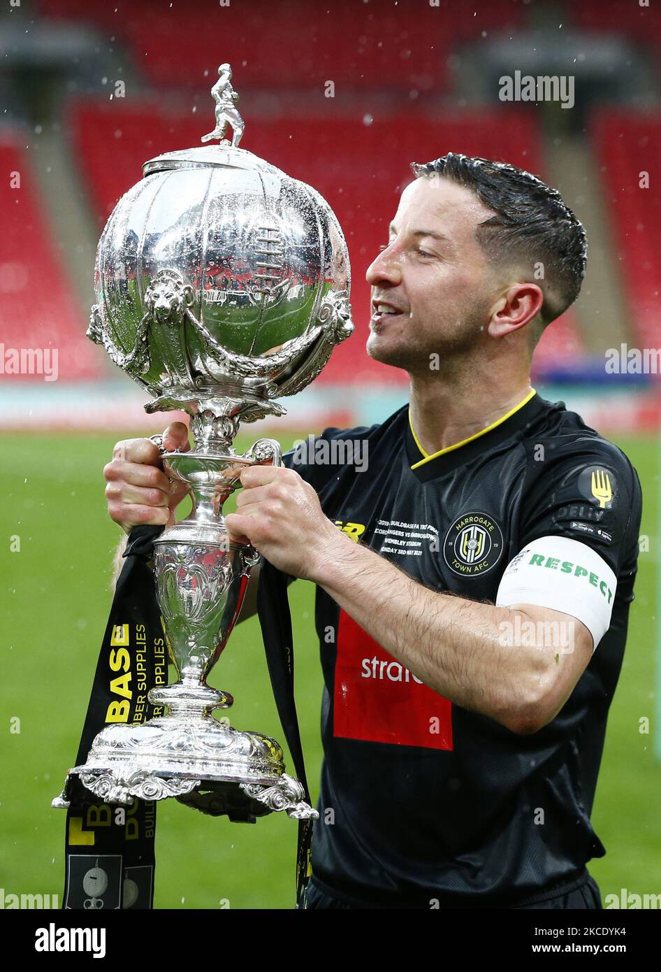 Josh Falkingham of Harrogate Town kisses Trophy during The 2019/2020 ...