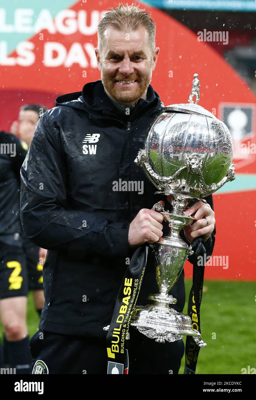 Simon Weaver manager of Harrogate Town holds Trophy during The 2019/ ...