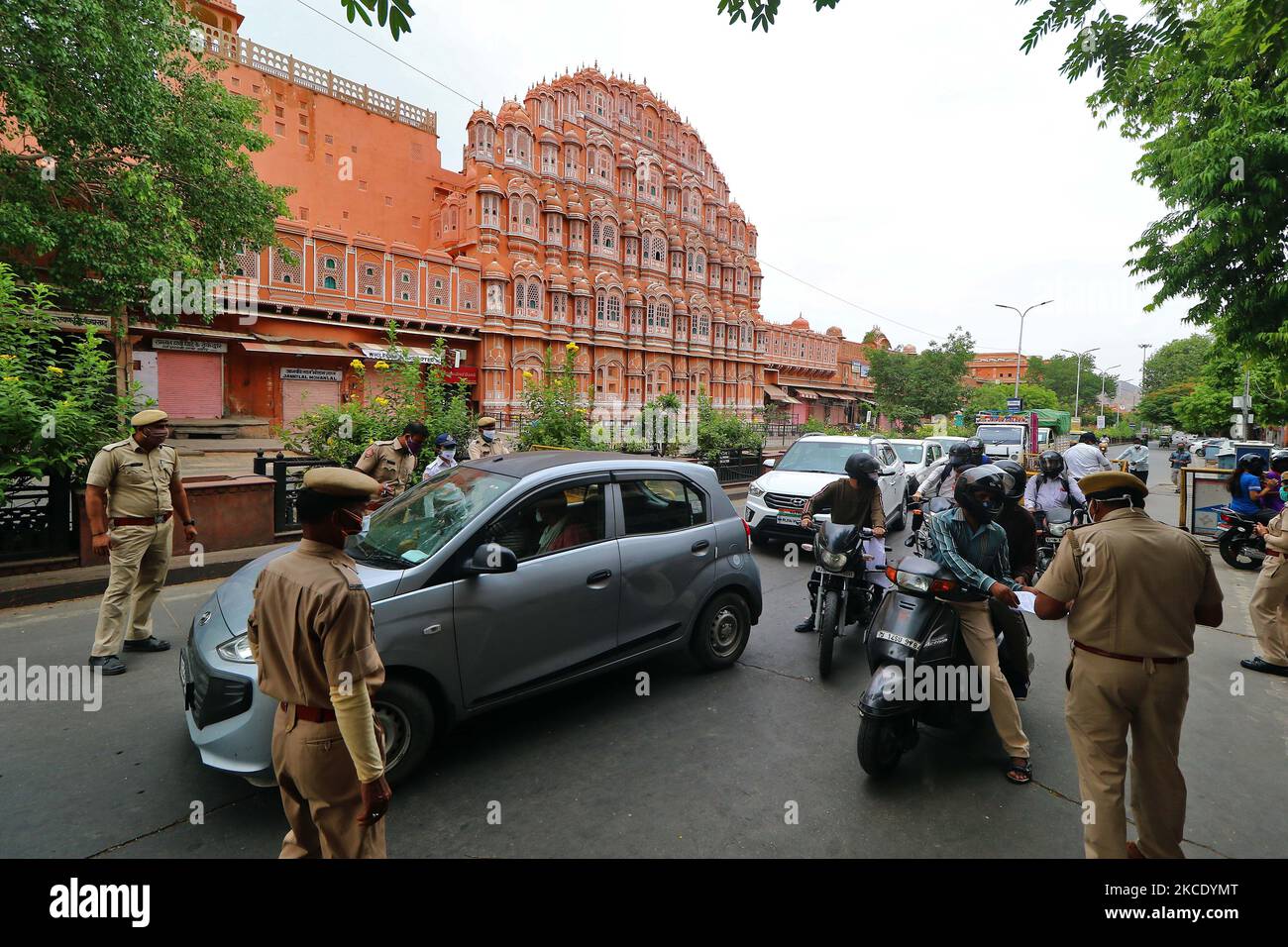 Security personnel check commuters during COVID-induced lockdown at ...