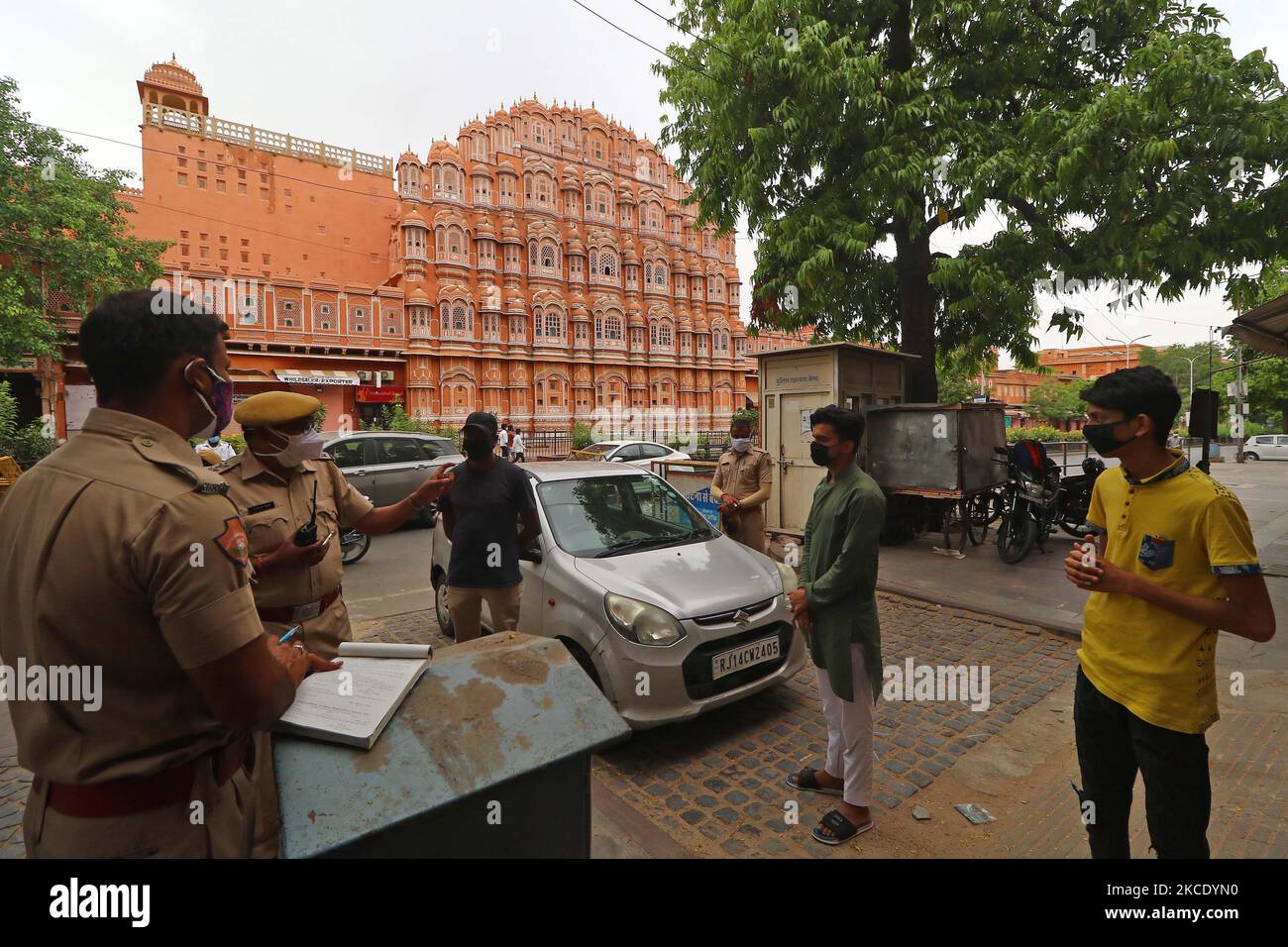 Security personnel check commuters during COVID-induced lockdown at ...