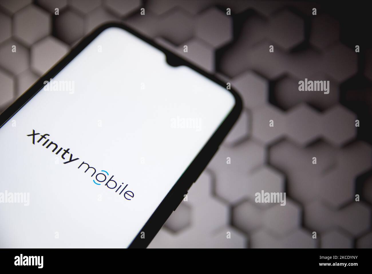 In this photo illustration a xFinity Mobile logo seen displayed on a ...