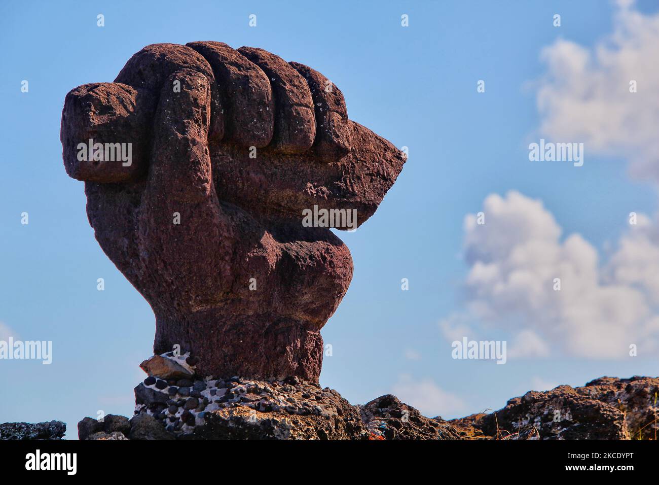 Sculpture of a giant hand by the South Pacific Ocean in Easter Island ...
