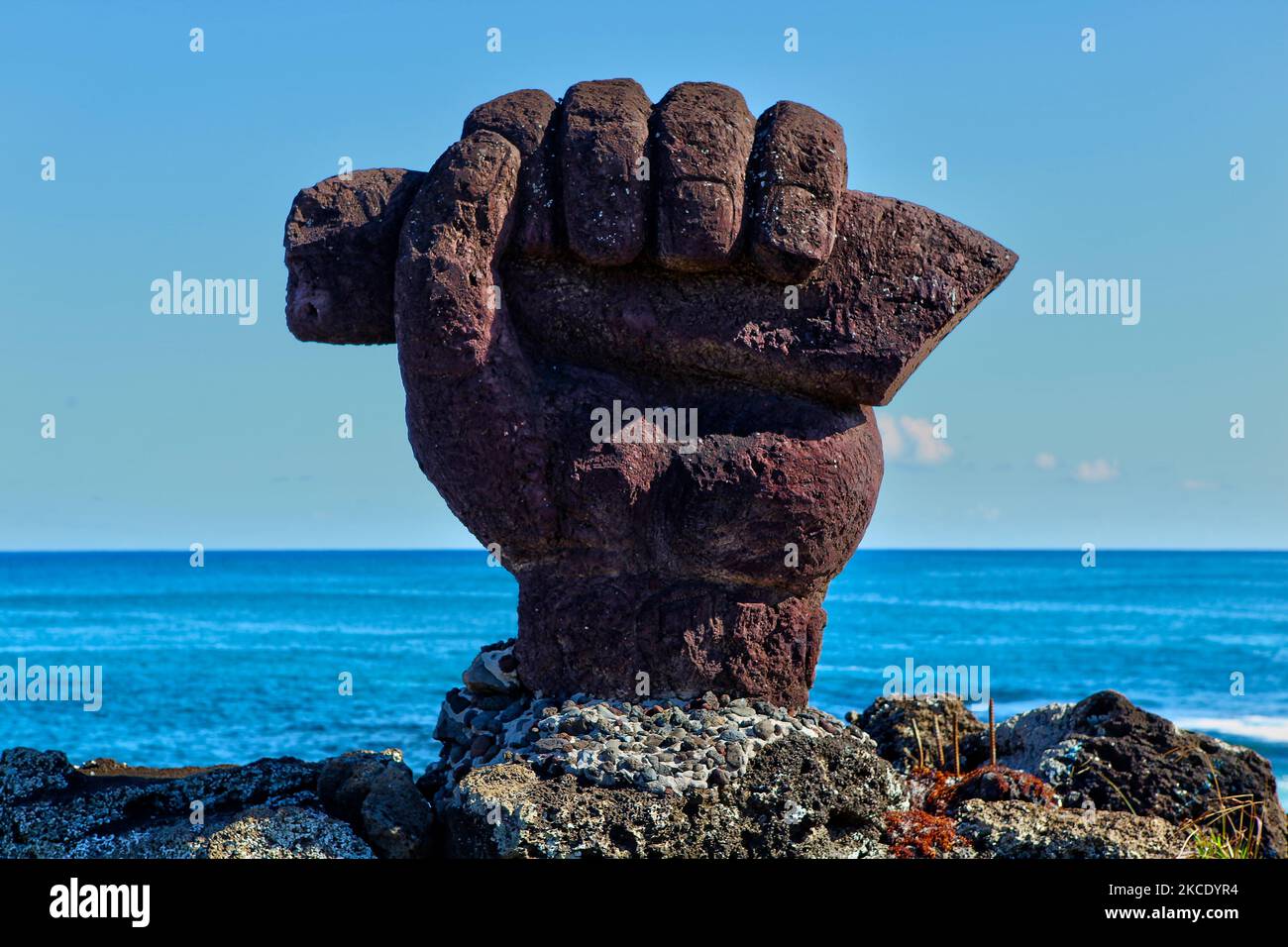 Sculpture of a giant hand by the South Pacific Ocean in Easter Island ...