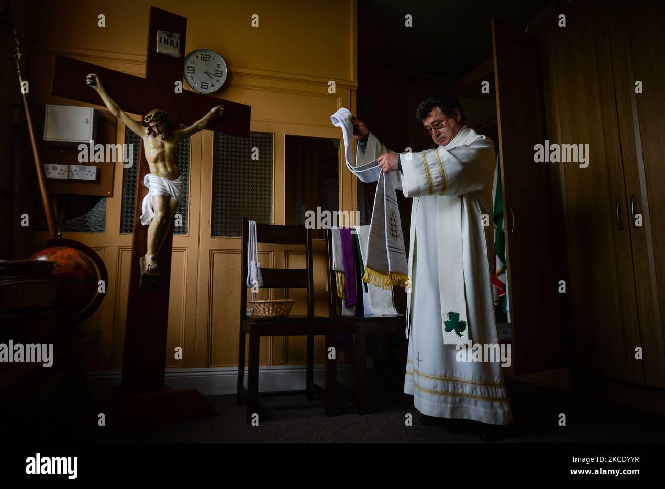 Father Krzysztof Sikora is getting ready for private prayer at the ...
