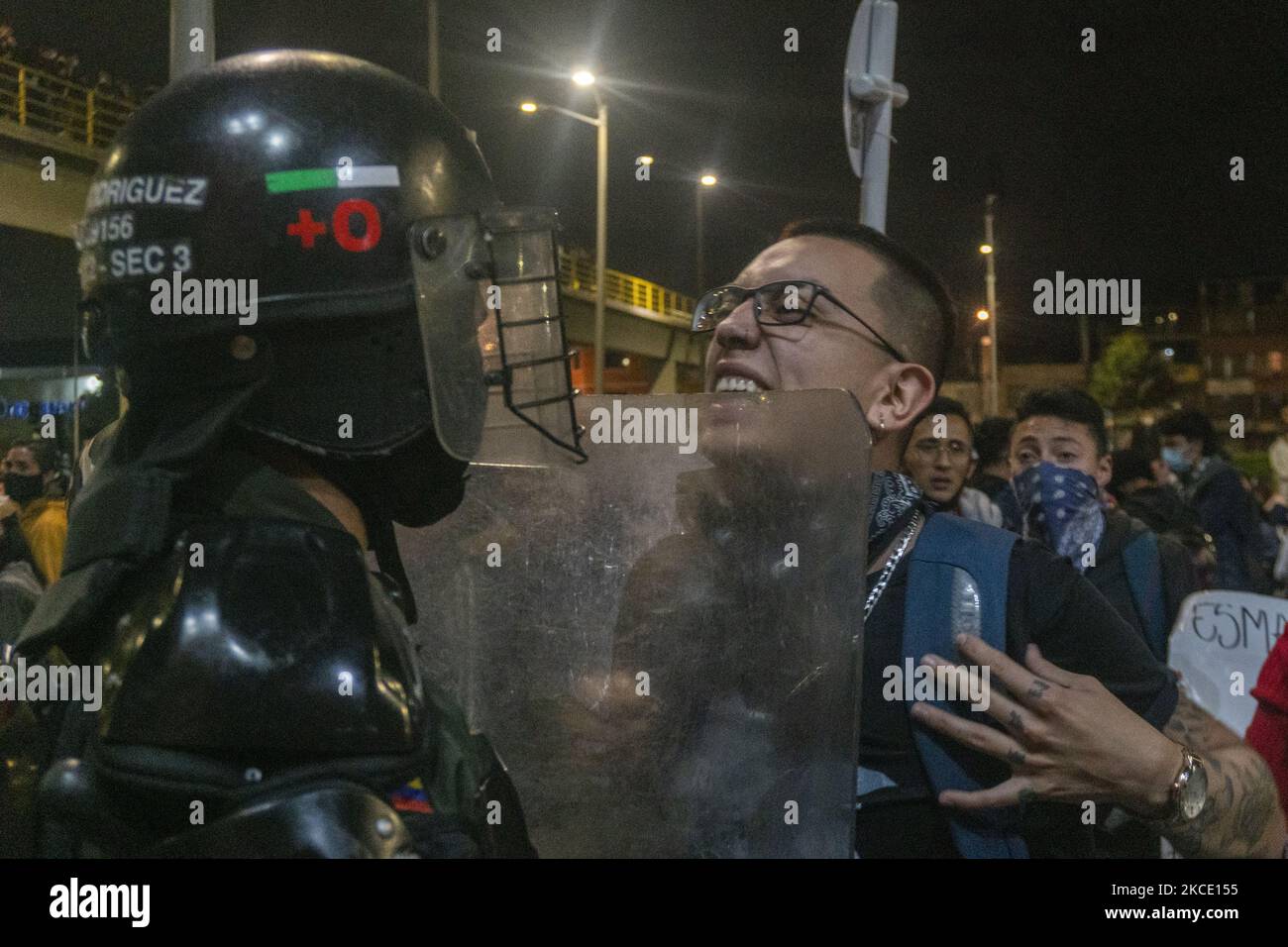 A man confronts an agent of the mobile anti-riot squad in Bogota. In ...