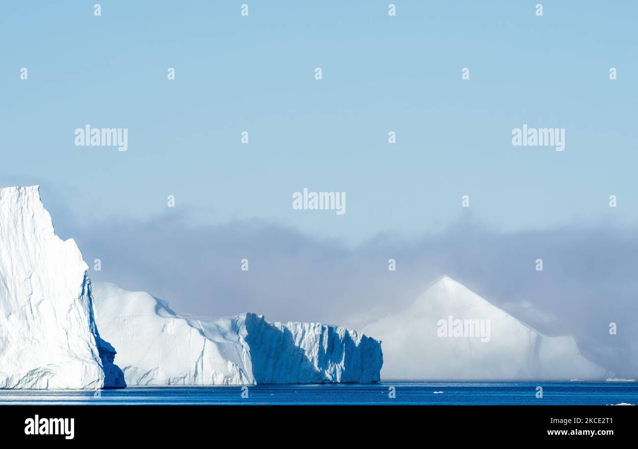 Icebergs near Ilulissat, Greenland. Climate change is having a profound ...