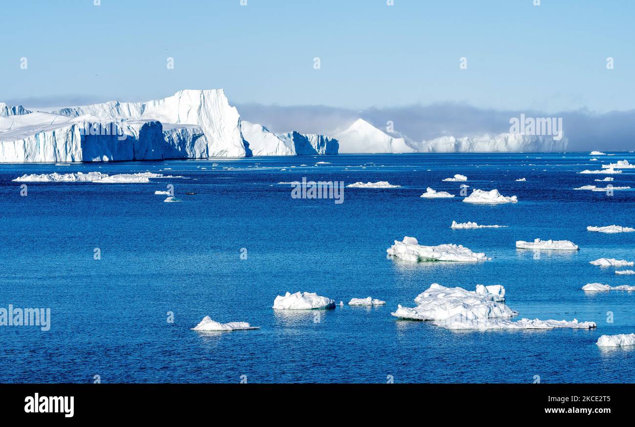 Icebergs near Ilulissat, Greenland. Climate change is having a profound ...