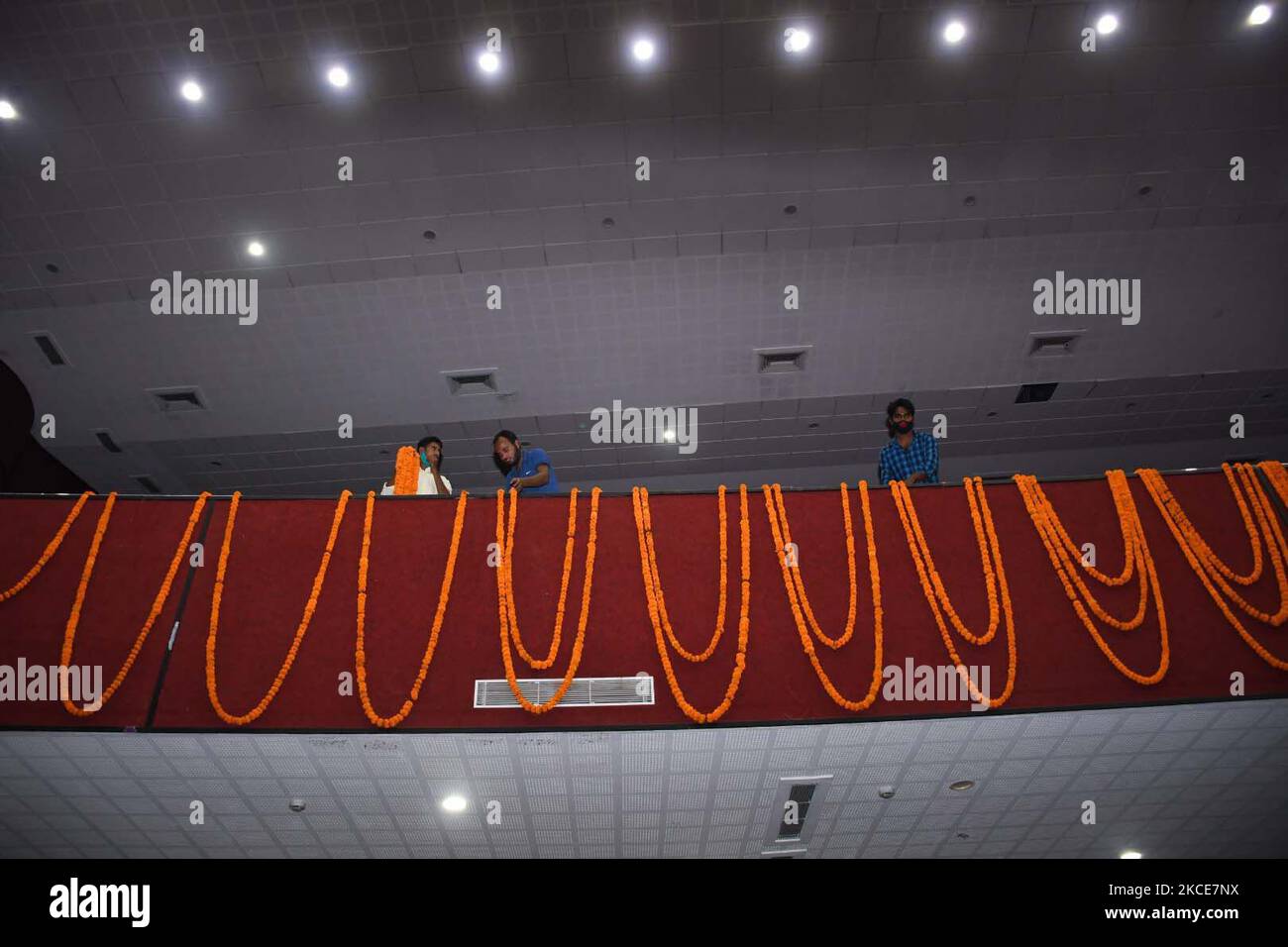 Worker decorate a Auditorium for oath taking ceremony of Chief Minister and other ministers of ...
