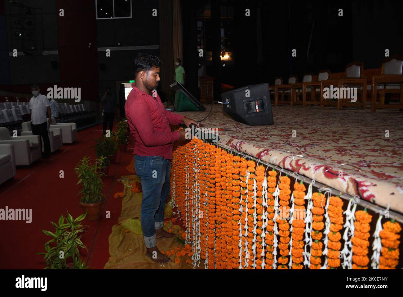 Worker decorate a Auditorium for oath taking ceremony of Chief Minister and other ministers of ...