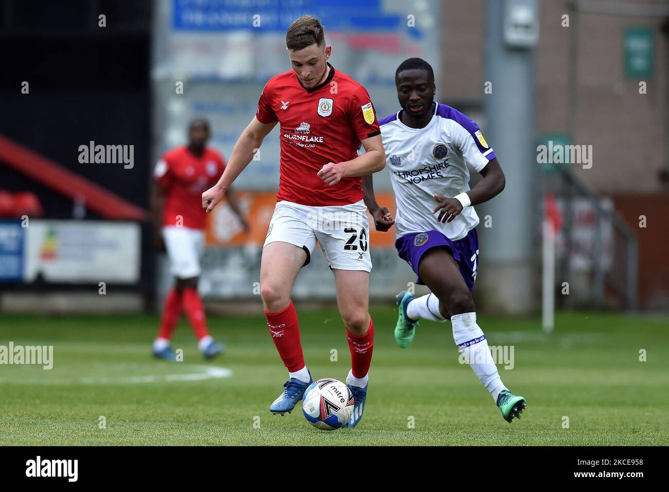 Josh Lundstram of Crewe Alexandra tussles with Daniel Udoh of ...