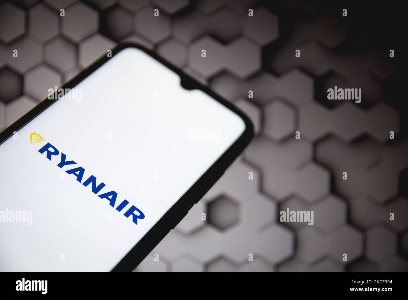In this photo illustration a Ryanair logo seen displayed on a ...
