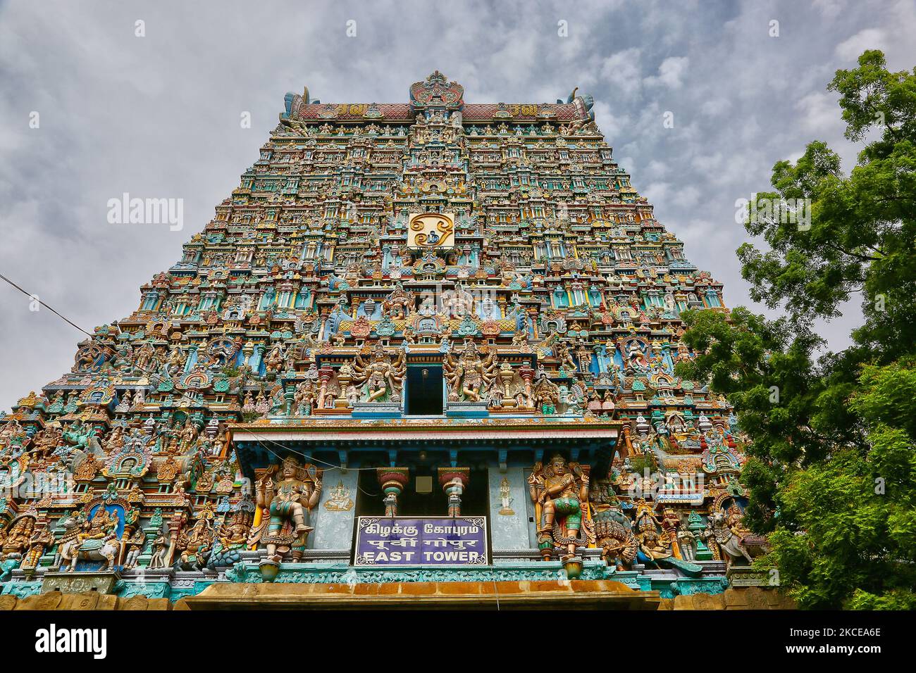 Colourful figures of Hindu deities adorn the gopura tower of the ...