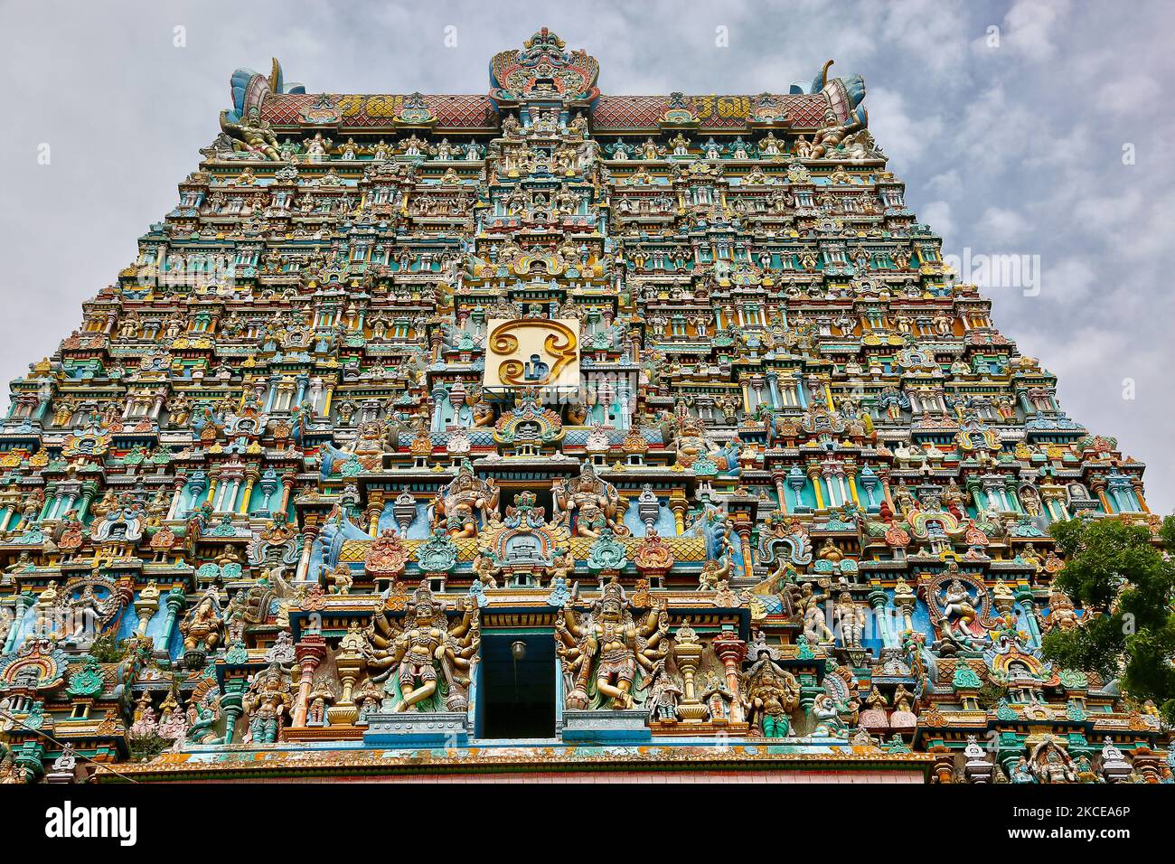 Colourful figures of Hindu deities adorn the gopura tower of the ...