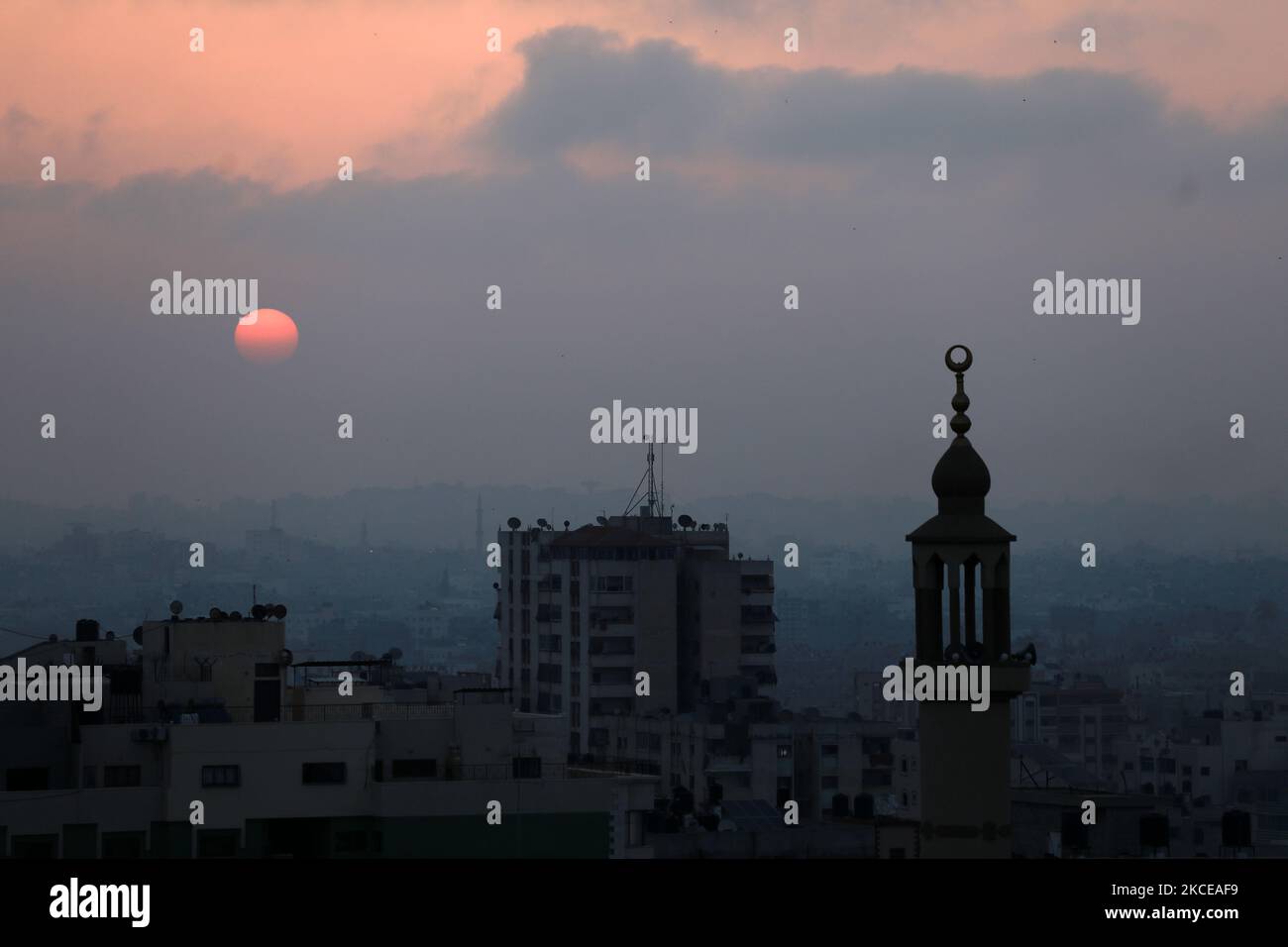The sun rises over Gaza City amid a flare-up of Israeli-Palestinian ...