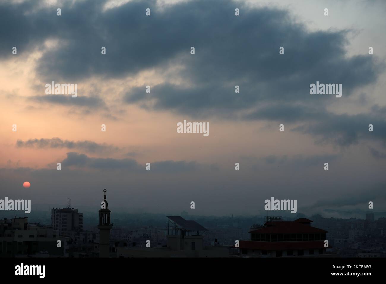 The sun rises over Gaza City amid a flare-up of Israeli-Palestinian ...