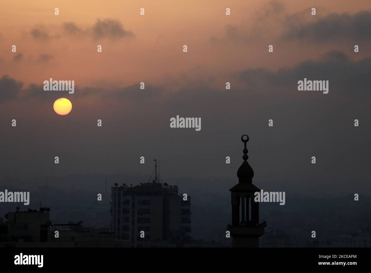 The sun rises over Gaza City amid a flare-up of Israeli-Palestinian ...