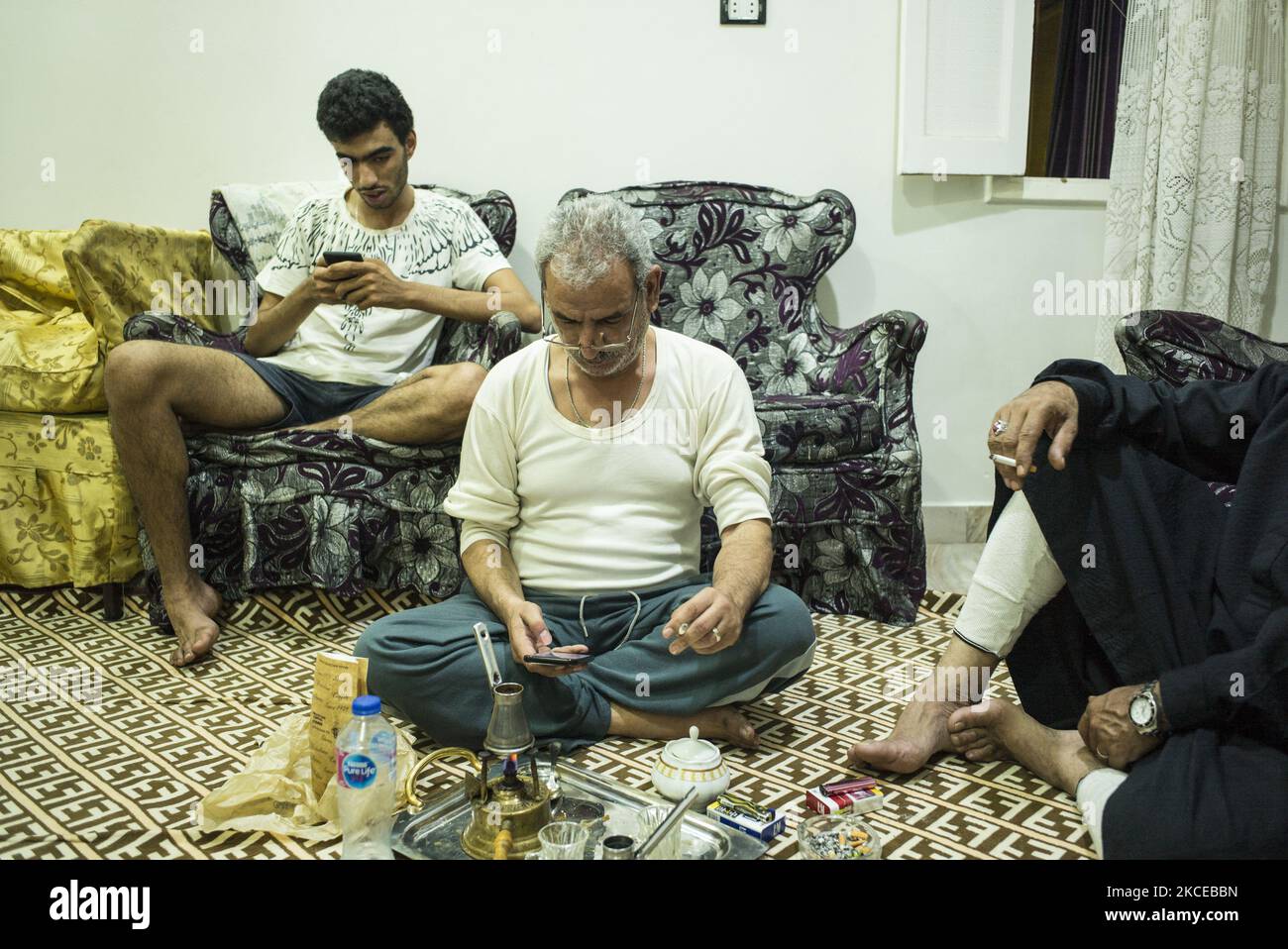 A family in Shoubra enjoys coffee after eating the iftar which is the ...