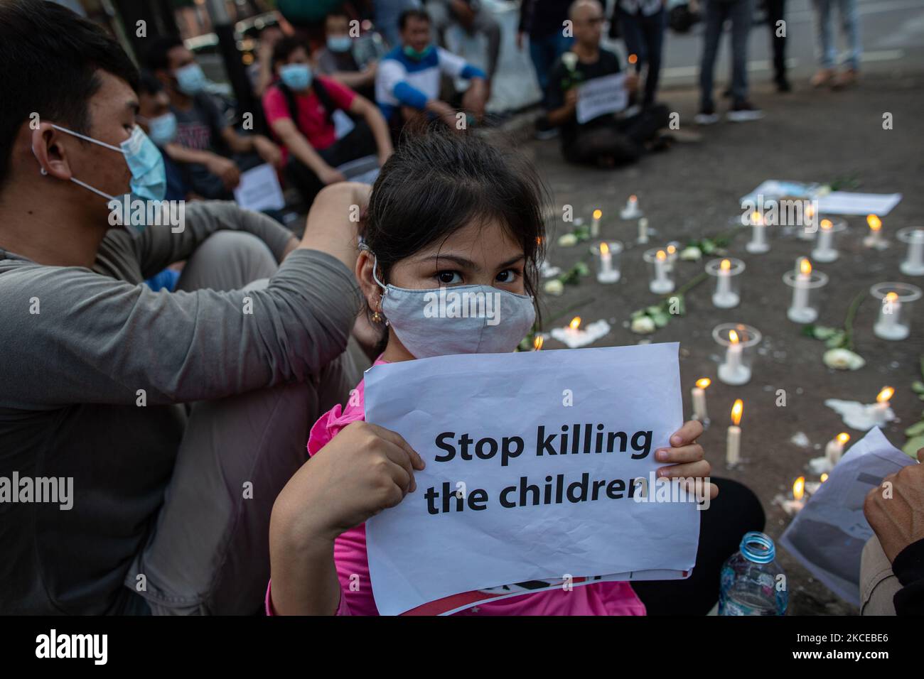 A little girl of refugees members of the Shiite Hazara community ...