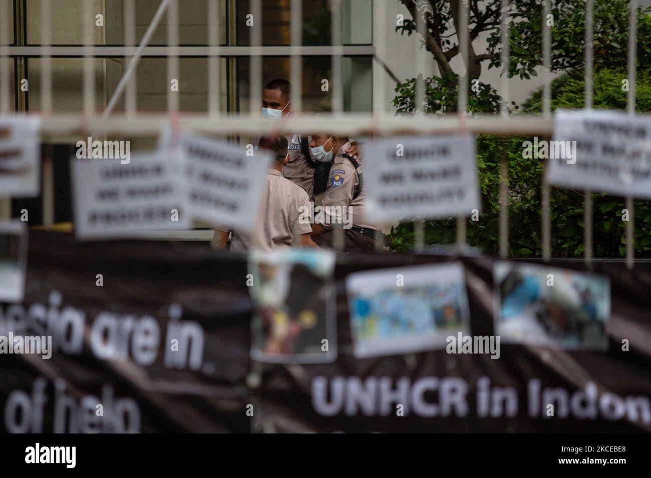 Security guard inside UNHCR during refugees members of the Shiite ...