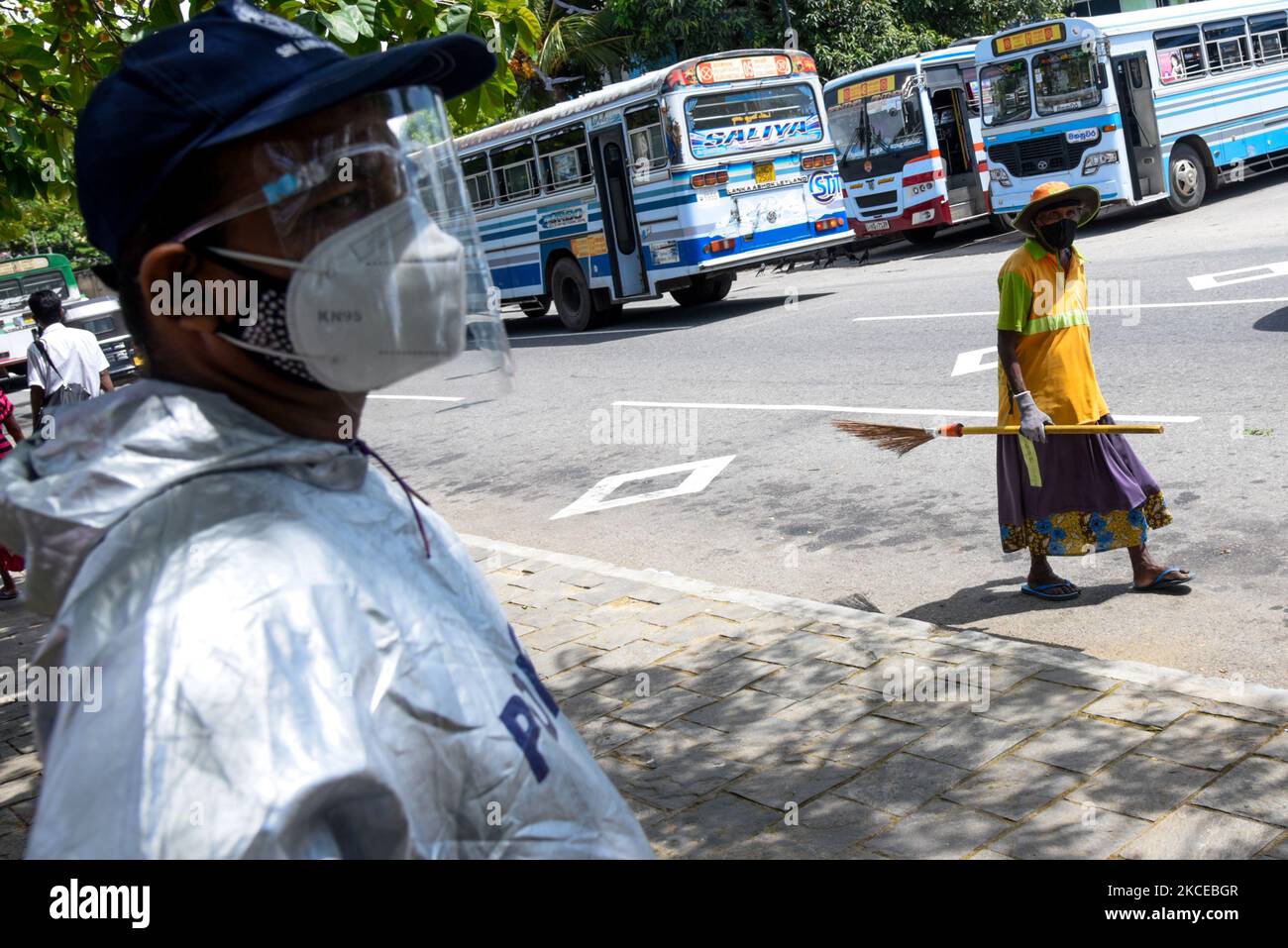 municipal worker wearing a face mask walking during COVID Pandemic near ...