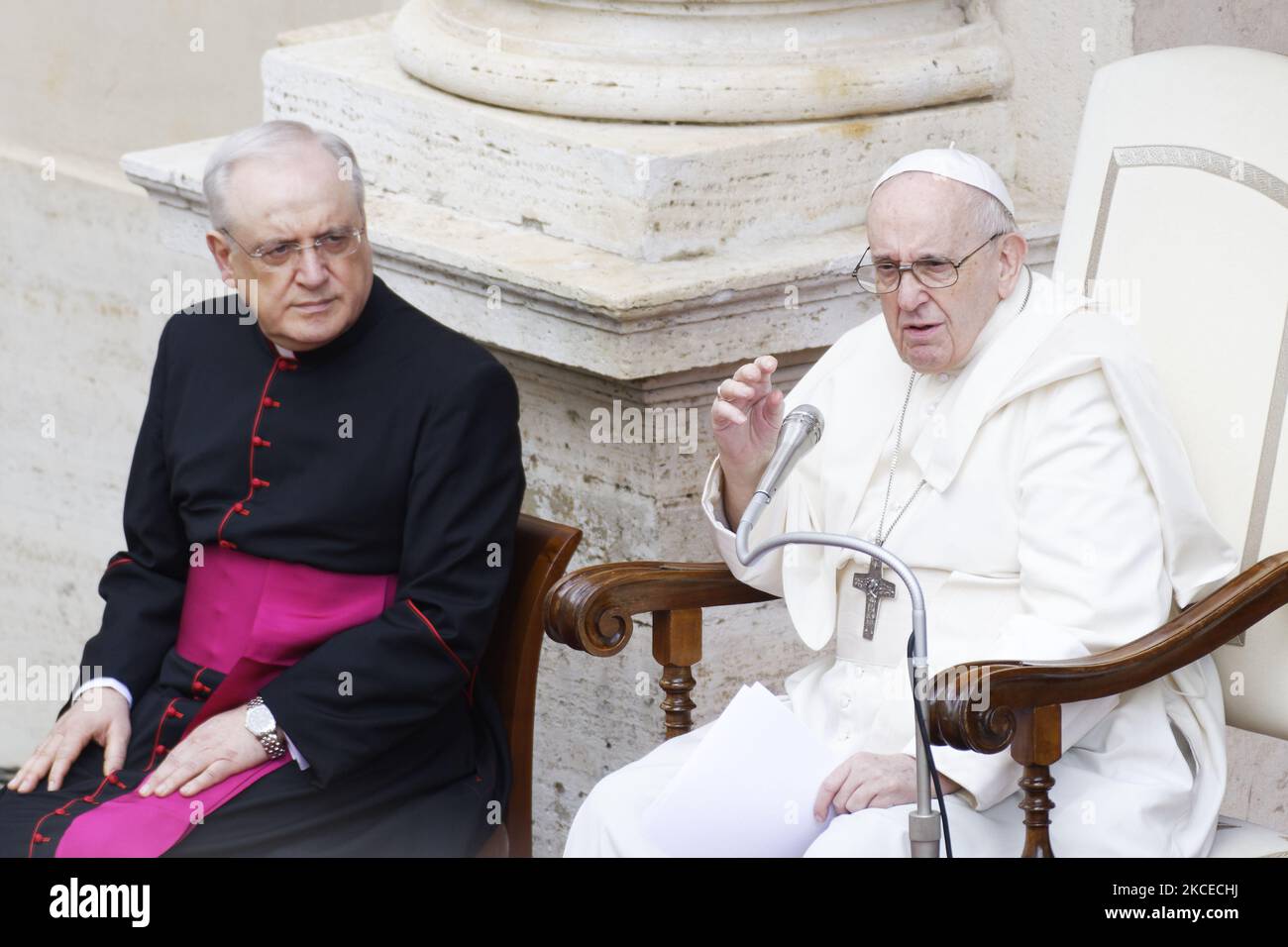 Pope Francis, right, begins the general audience in the St. Damaso ...