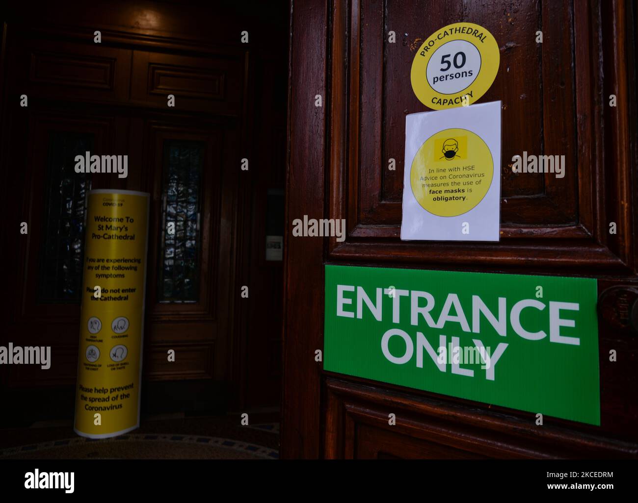 COVID-19 related signs at the entrance to St. Mary's Pro-Cathedral, the ...