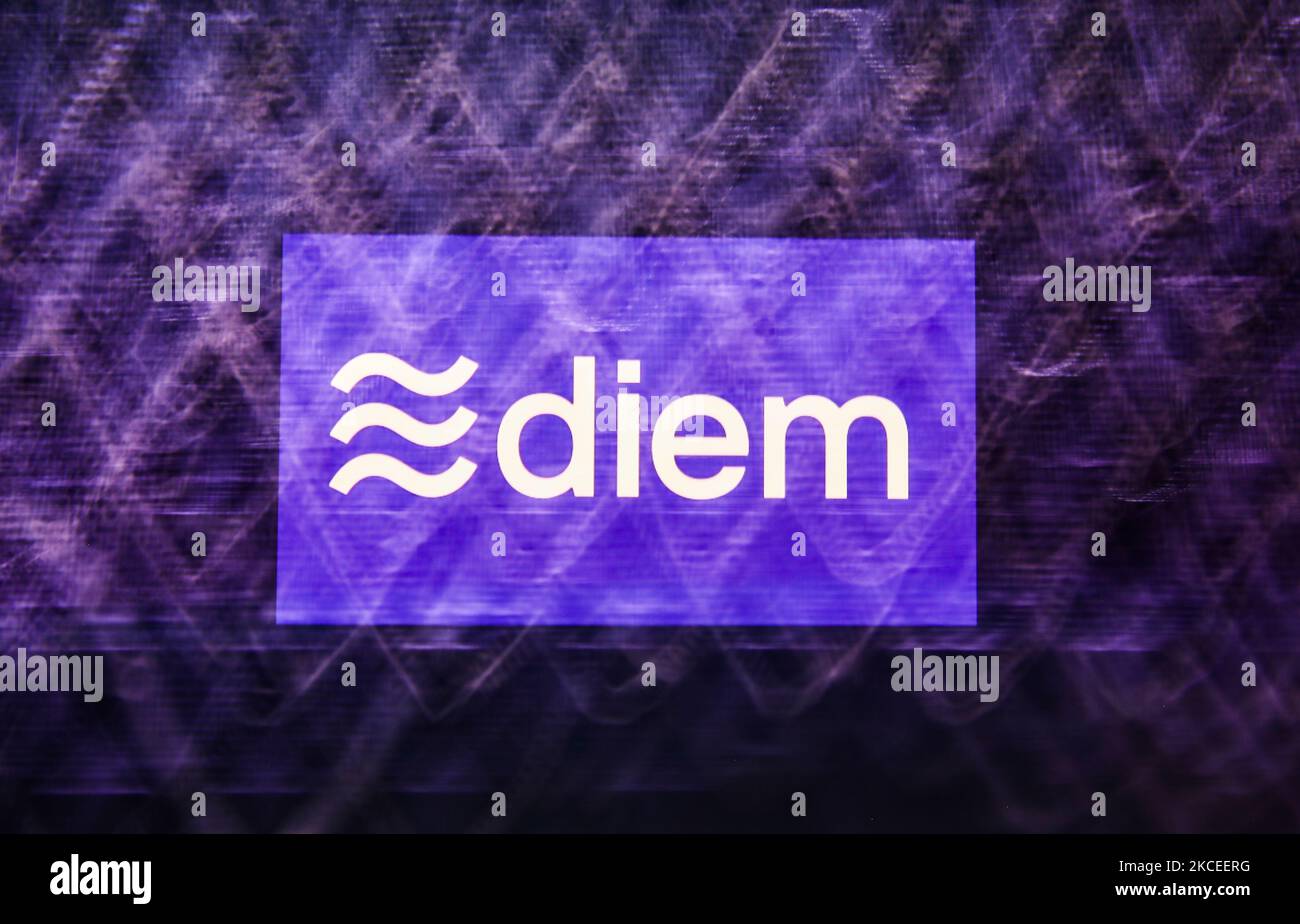 Logo of Diem digital currency displayed on a phone screen and a ...