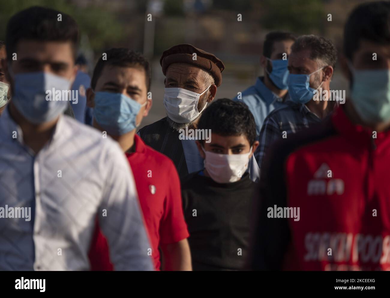 Afghan Sunni refugee men arrive an area that has used as a place for ...