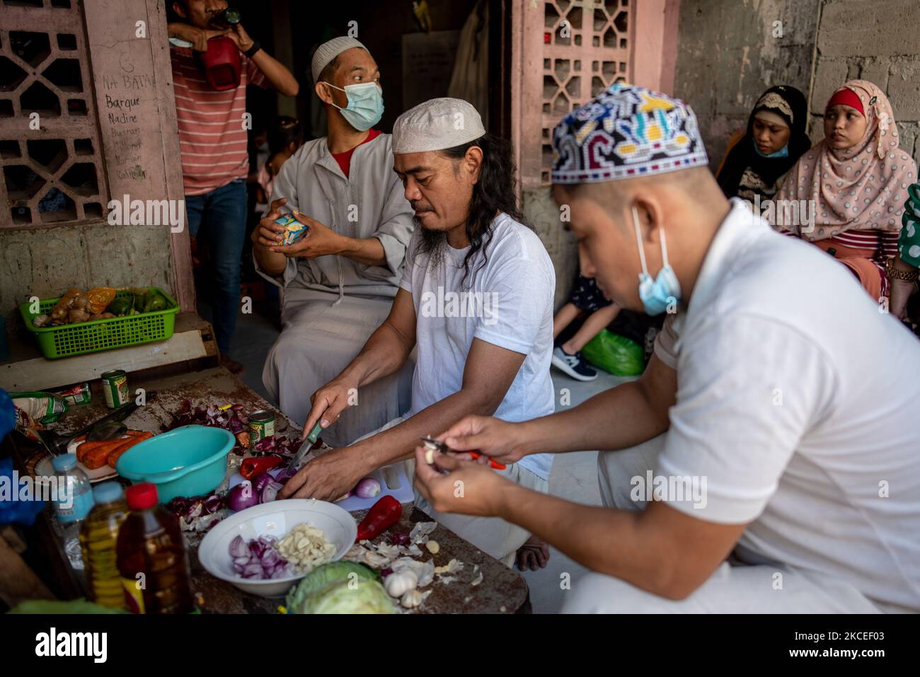 Filipino Muslims prepare food to celebrate Eid al-Fitr as they mark the ...