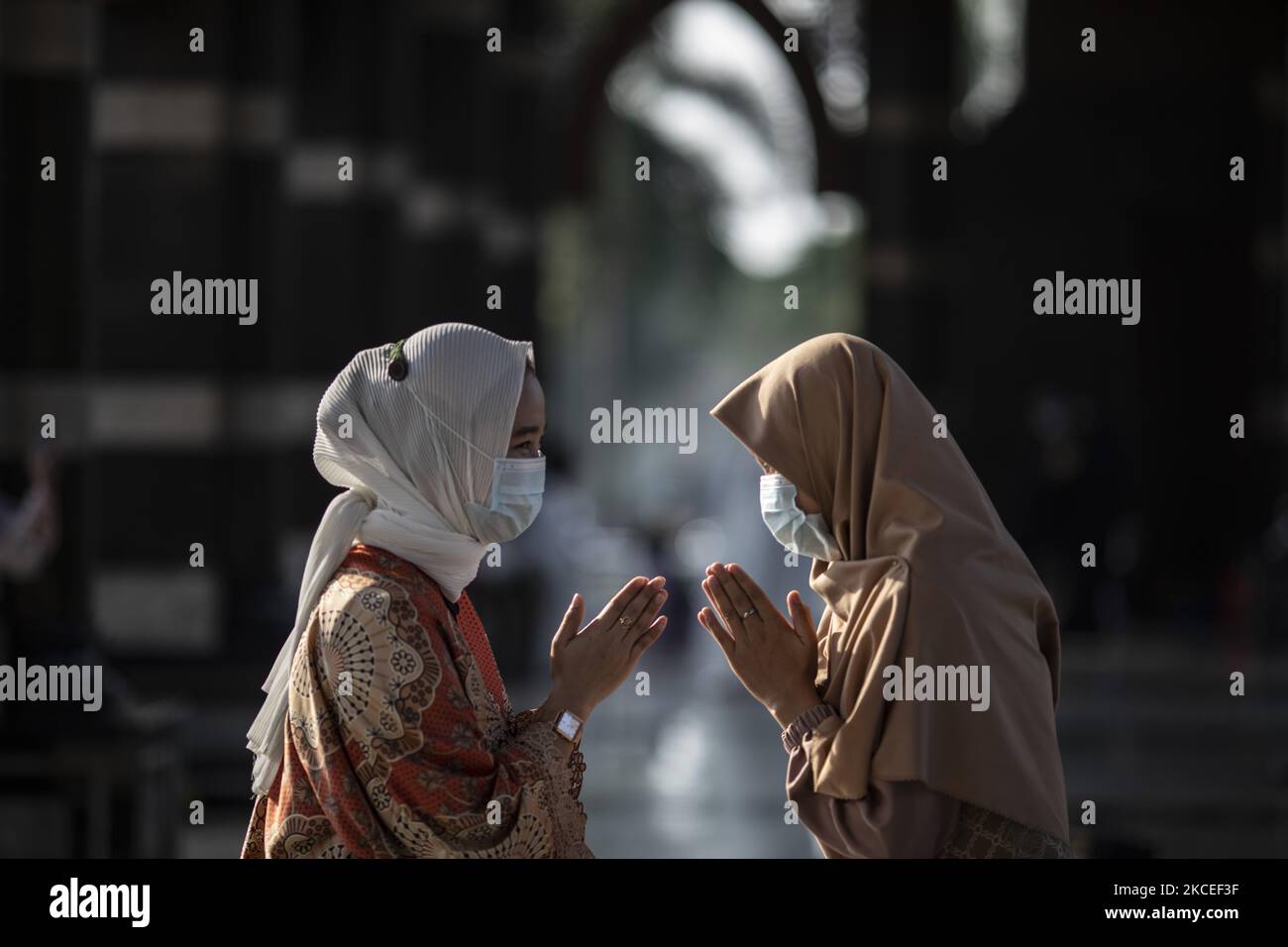 People during the Eid al-Fitr prayer at the Golden Mosque, in Depok ...