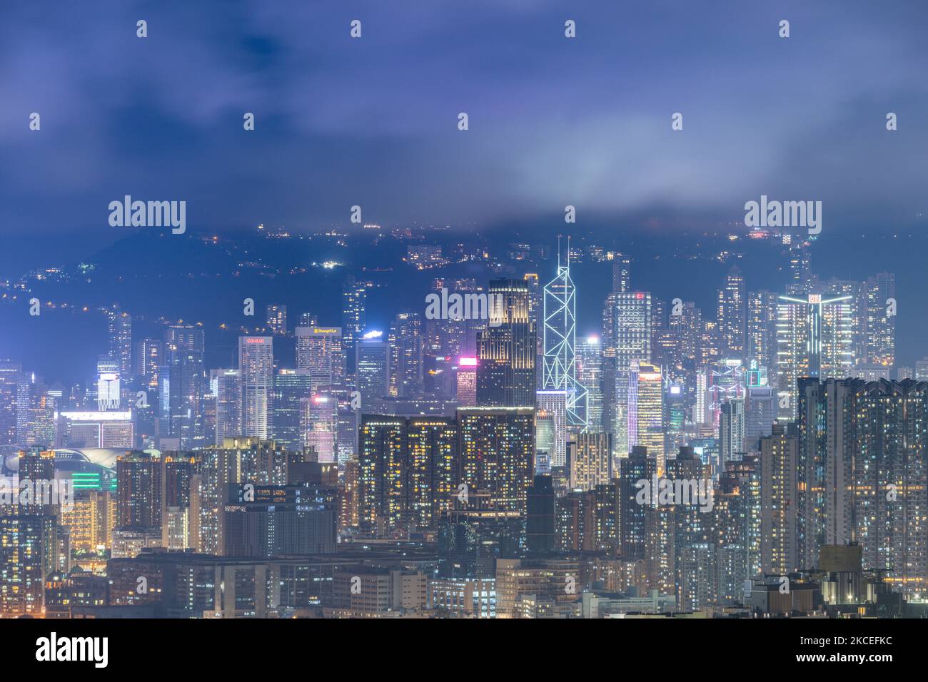 Buildings on Hong Kong island can be seen under a low cloud ceiling ...