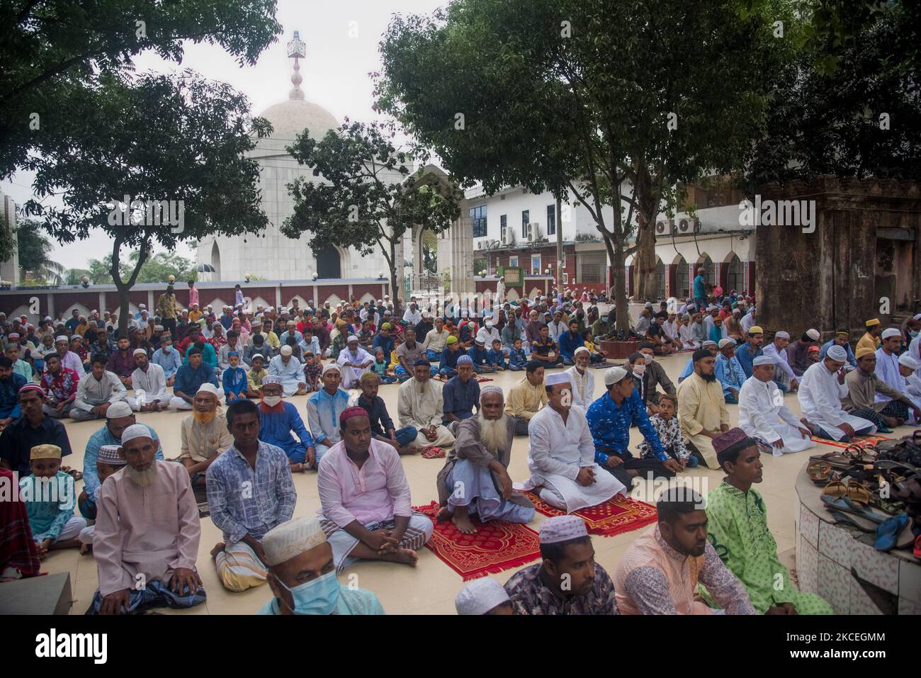 Muslims in Bangladesh are praying outside of the mosque at the day of ...