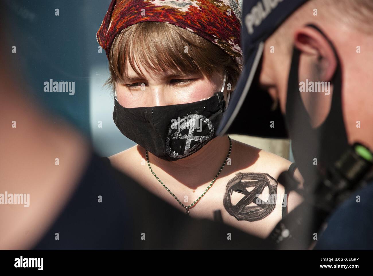 Climate activists gathered in front of one of Warsaw city center's ...