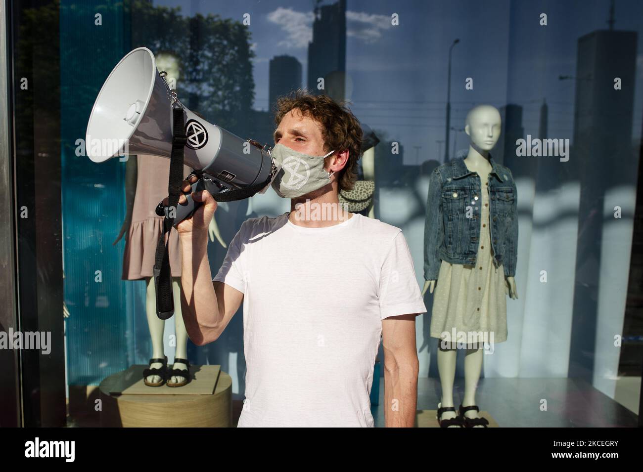 Climate activists gathered in front of one of Warsaw city center's ...