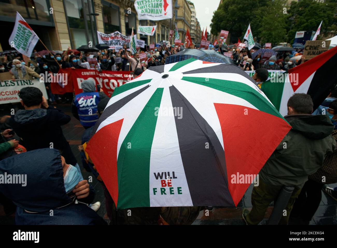 An umbrella at the Palestine colors. Hundreds of people gathered in ...