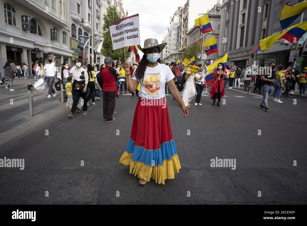 Colombians living in Madrid take part in a demonstration in support of ...