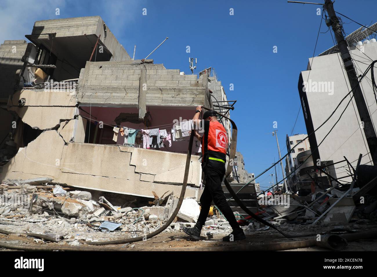 Palestinian paramedics search for survivors under the rubble of a ...