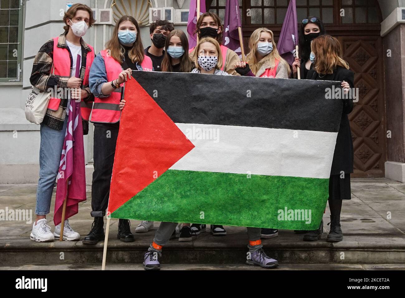 Protesters with pro-Palestinian banners and flags of Palestina are seen ...