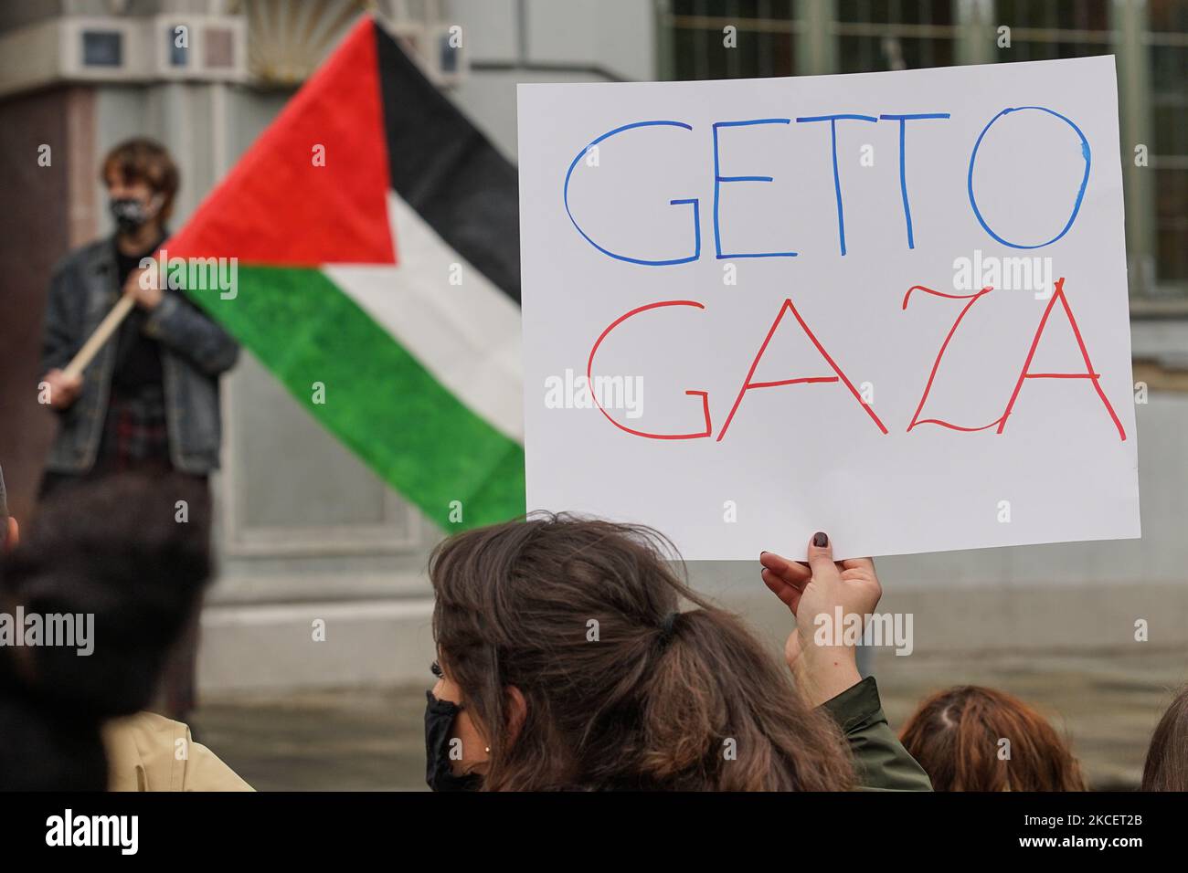 Protesters with pro-Palestinian banners and flags of Palestina are seen ...