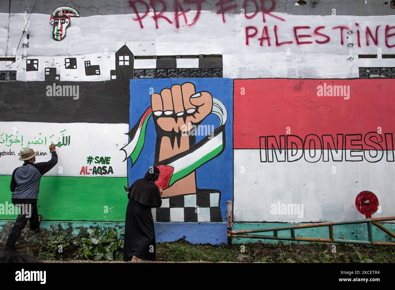 A Painting pro-Palestine is seen at a wall in Depok, West java ...